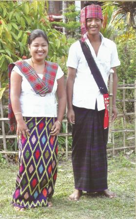 A Singpho tribal youth in their traditional attire at a local Singpho ...