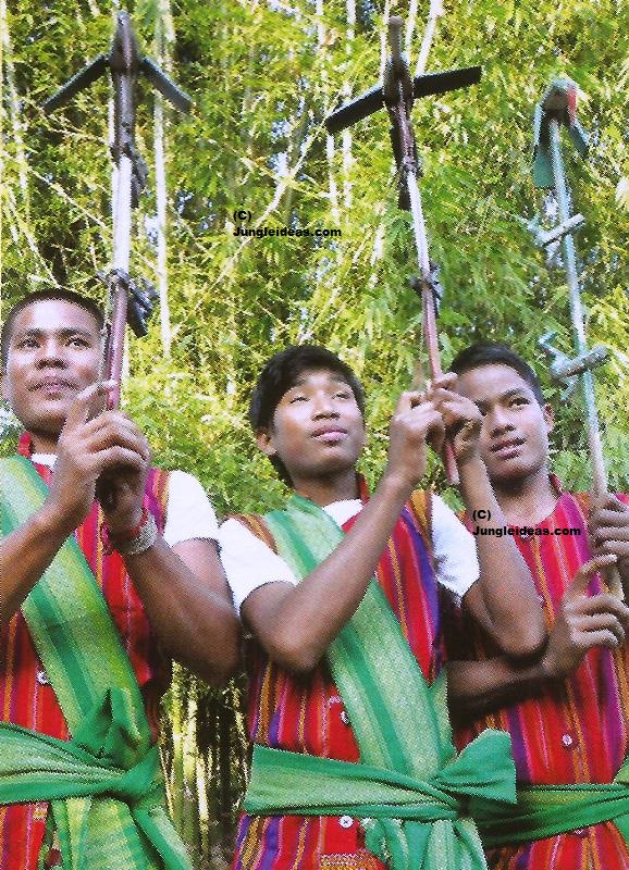 The Rabha people with traditional hunting weapons at Chandubi in Assam ...